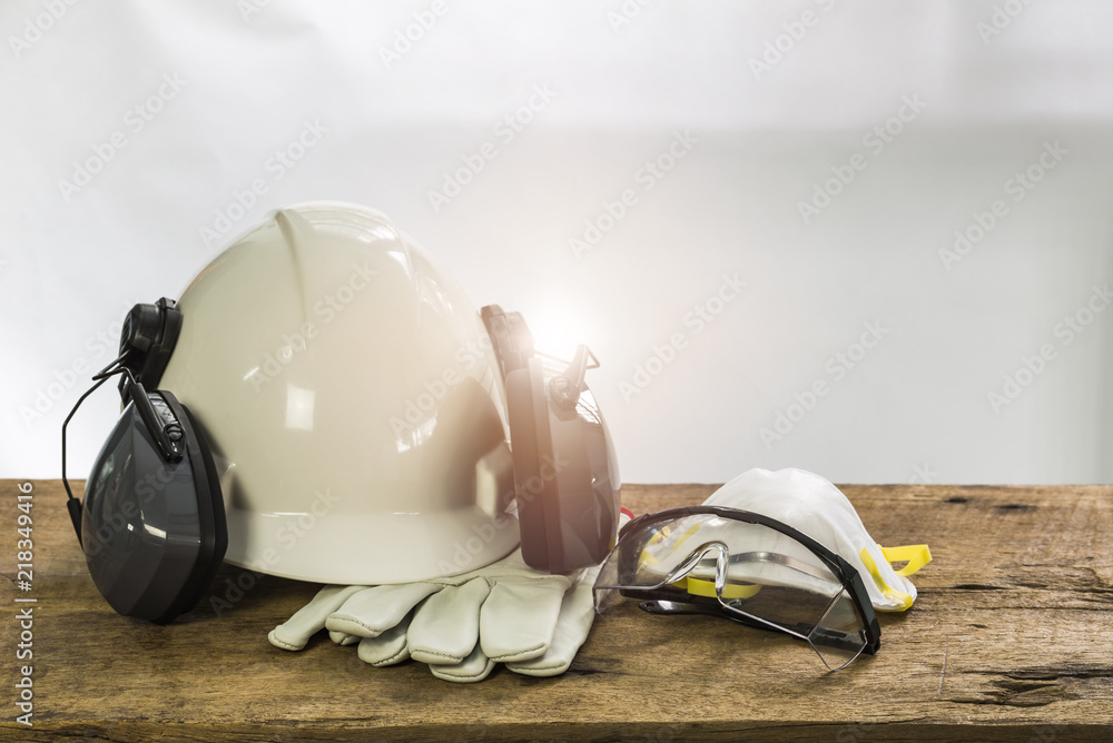 Foto de PPE onsist with White safety helmet (hard hat) with ear muff ...