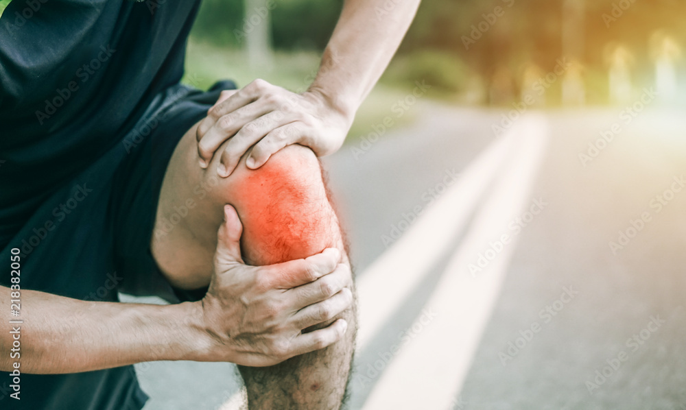 Sport injury. Accident concept,Young fitness man holding his sports leg ...
