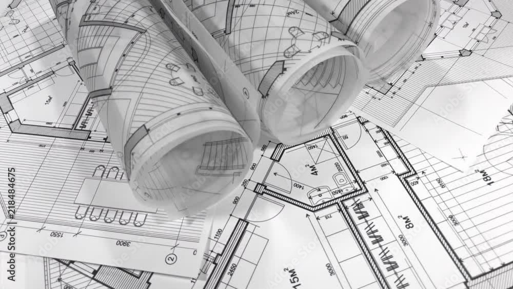 Blueprints - rolls of architectural drawings smoothly rotate on the ...
