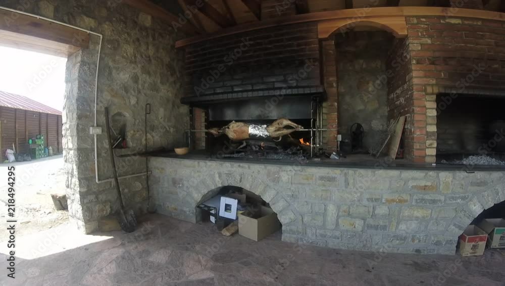 Traditional way of cooking a whole animal (lamb, goat) - roasting an ...