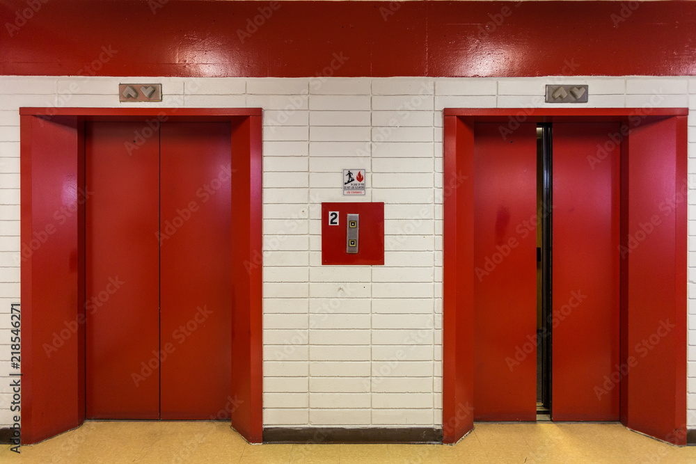 Red elevators with white tiles Stock Photo | Adobe Stock