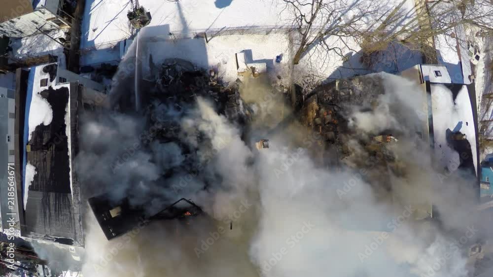 Smoke Rises from a Smoldering House Fire in a Crowded Area, Top Down ...