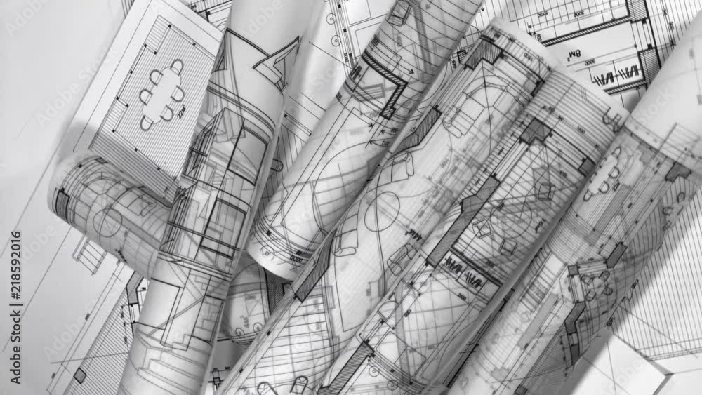 Blueprints - rolls of architectural drawings smoothly rotate on the ...