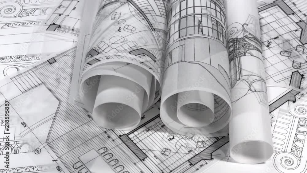 Blueprints - rolls of architectural drawings smoothly rotate on the ...