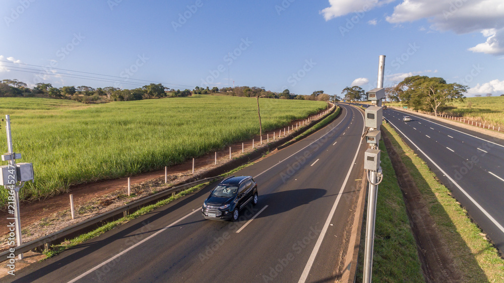 Traffic radar with speed enforcement camera in a highway. Automatic ...