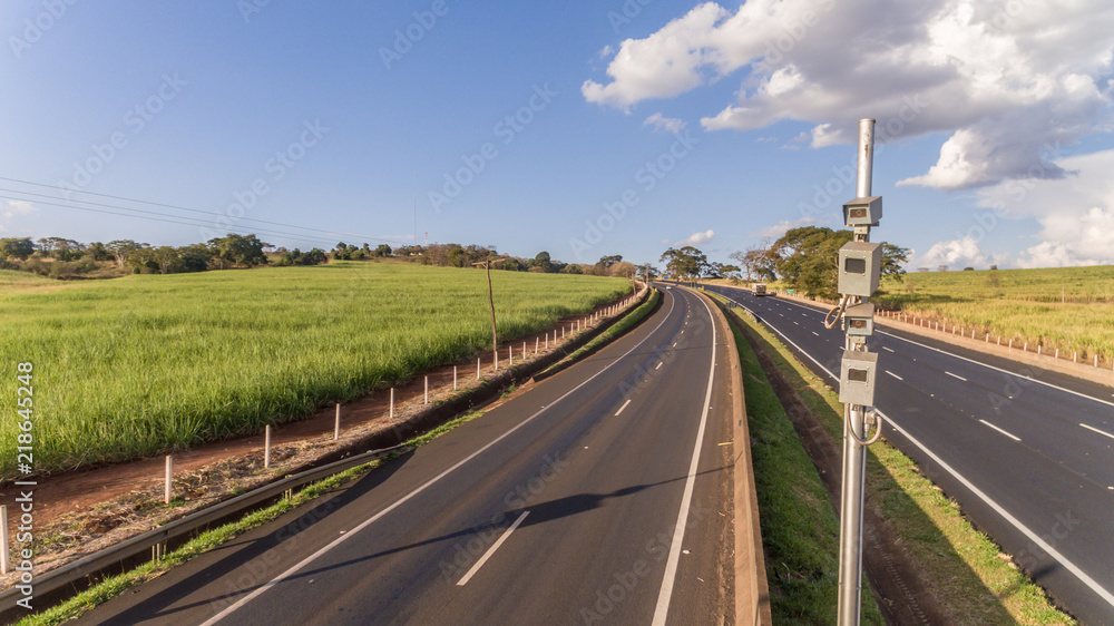 Traffic radar with speed enforcement camera in a highway. Automatic ...