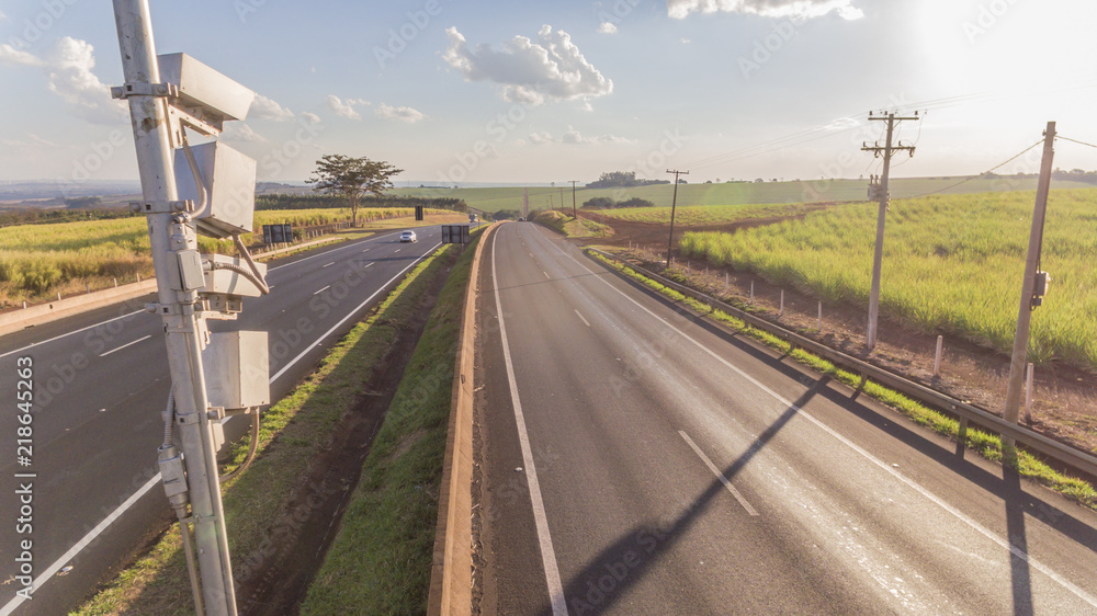 Traffic radar with speed enforcement camera in a highway. Automatic ...