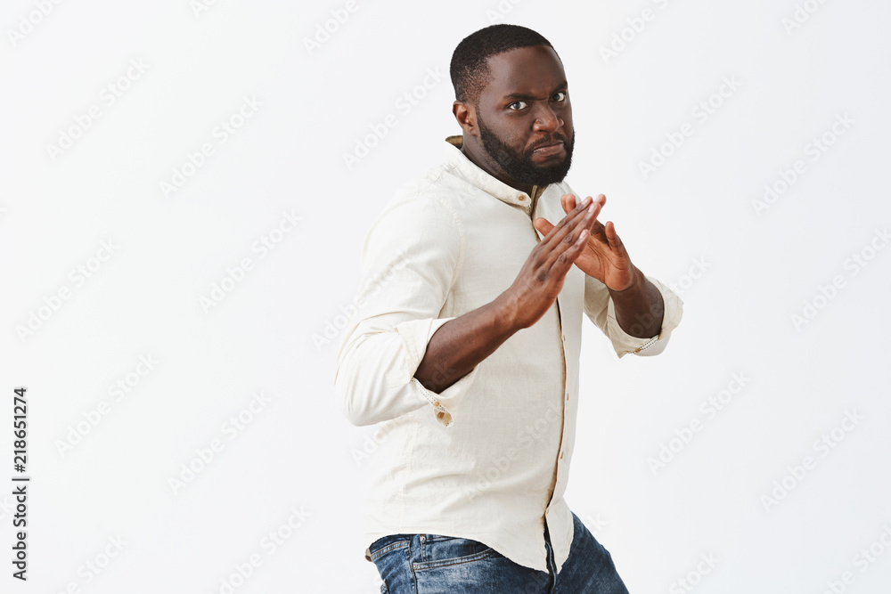 Defend yourself. Portrait of serious-looking strong and funny dark ...