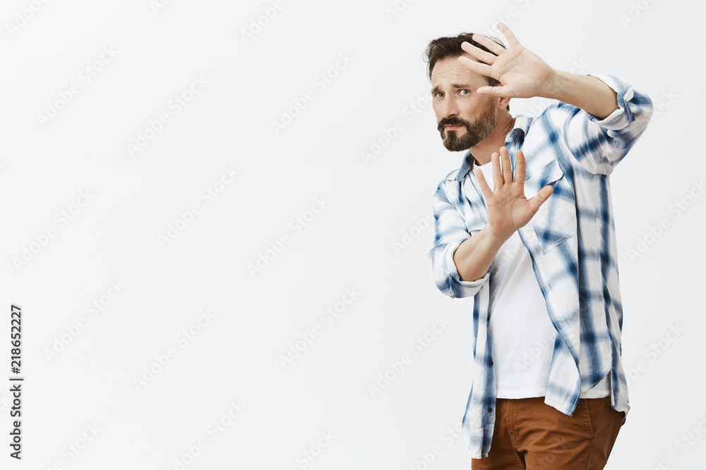 Frightened man being scared bully will hit him in face, tilting ...