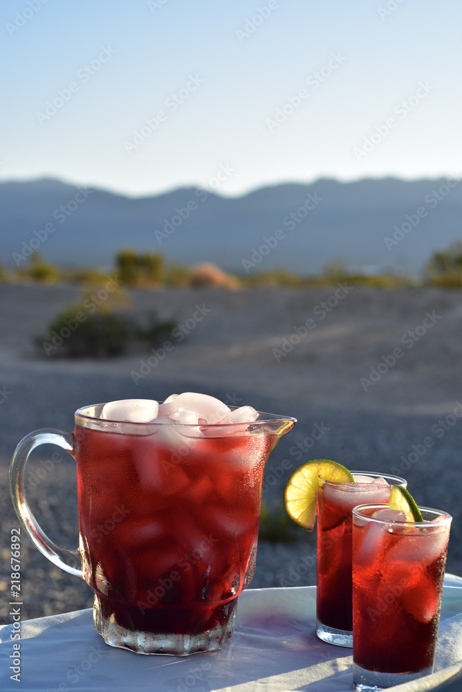 pitcher and glasses of hibiscus flower iced tea in Mojave Desert ...