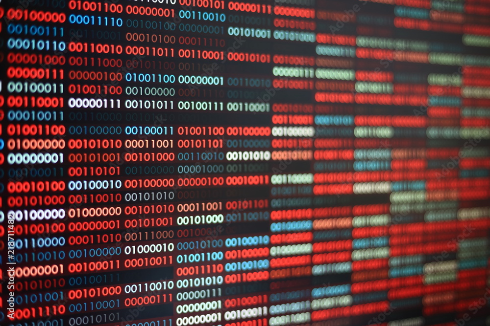 Computer virus infection. Row of binary codes randomly colored red and ...