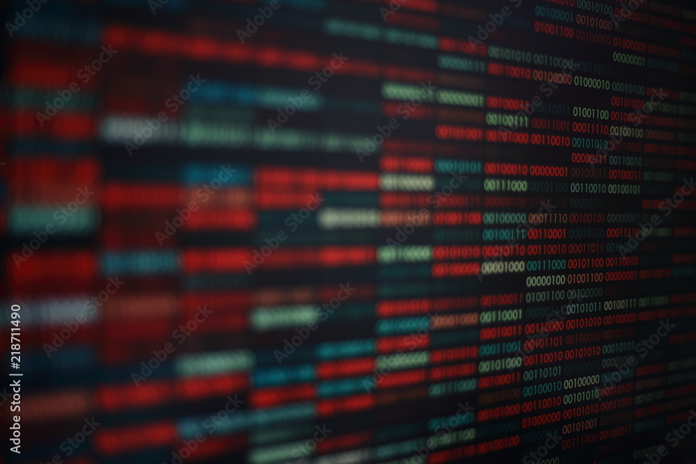 Computer virus infection. Row of binary codes randomly colored red and ...