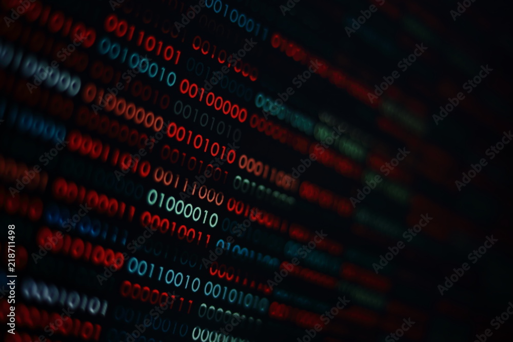 Computer virus infection. Row of binary codes randomly colored red and ...