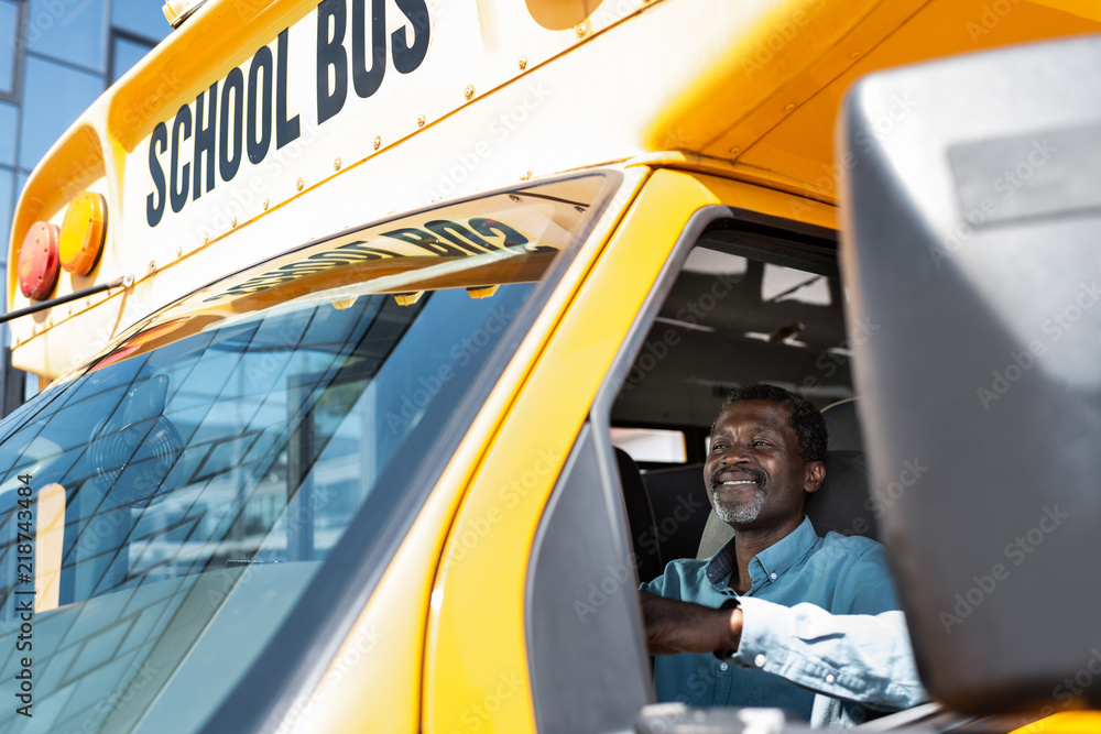 view through side window at mature african american bus driver Stock ...