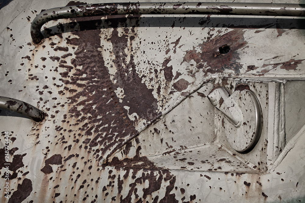 a hole from a projectile in the armor of a tank close-up Stock Photo ...