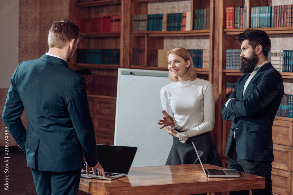 Teamwork concept. Group of students training teamwork skills in library ...