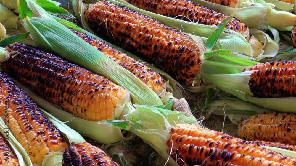 Fried and boiled corn. A seller of fast food at a flea market in Turkey ...