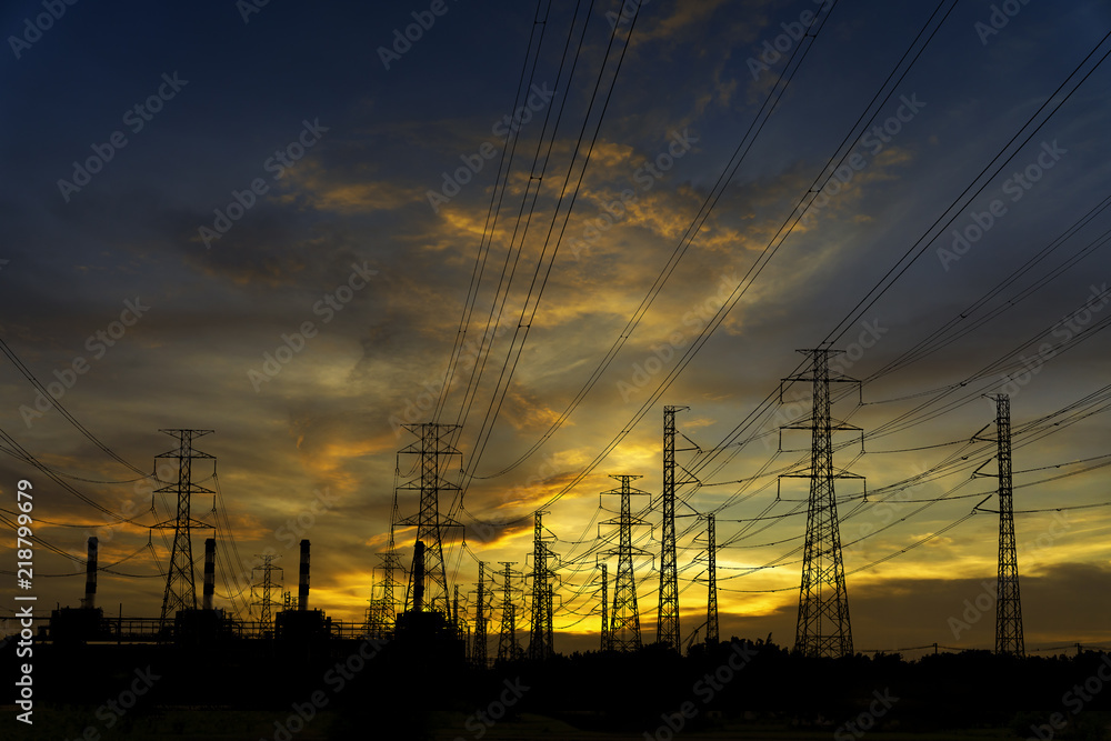 Silhouette power plant and high voltage electric tower on sunset time ...