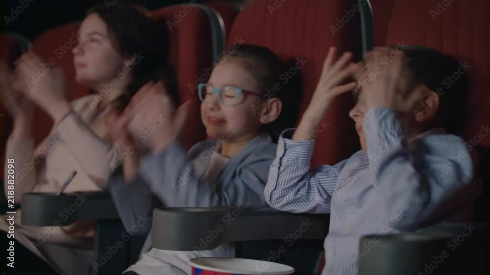 Video Stock Children got scared in cinema. Kids are frightened at movie ...