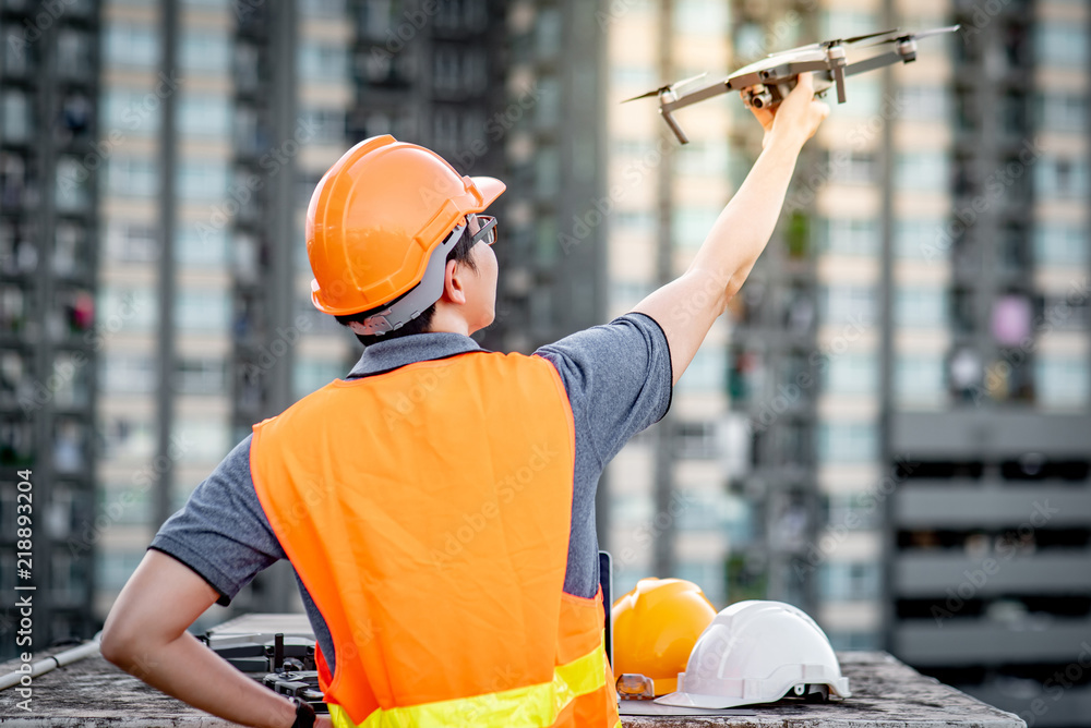 Young Asian engineer man working with drone laptop and smartphone at ...