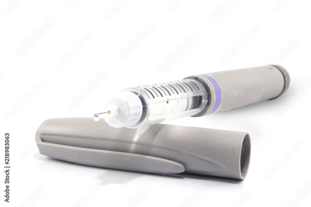 Insulin pen with insulin drop at needle tip isolated on white ...