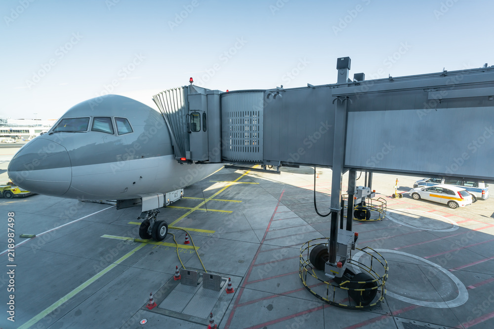 transport and logistic concept by plane. Airplane with airport bridge ...