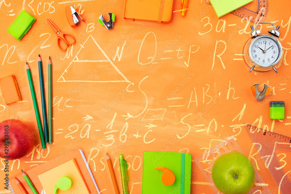 Back to school styled flat lay frame with multicolored school supplies ...