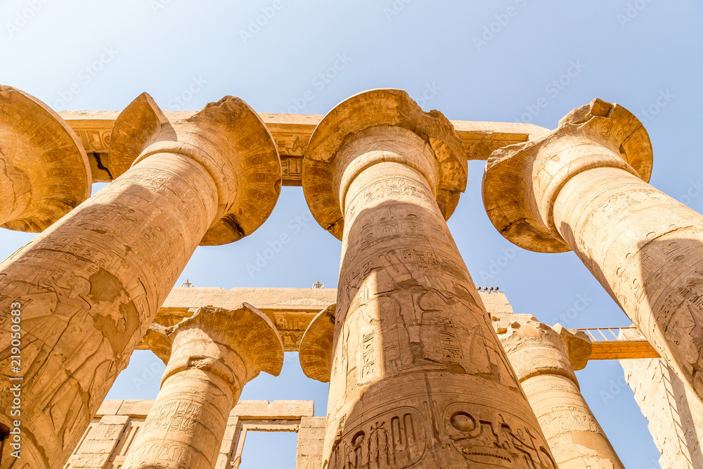 Egyptian symbols on the pillars of ancient temple in Luxor Stock Photo ...