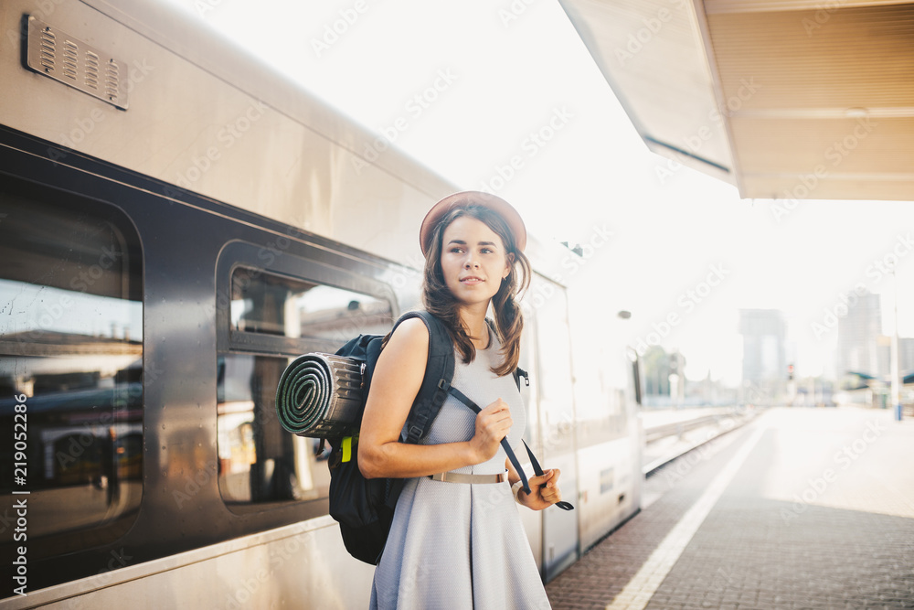 theme railway and travel. Portrait young caucasian woman with toothy ...