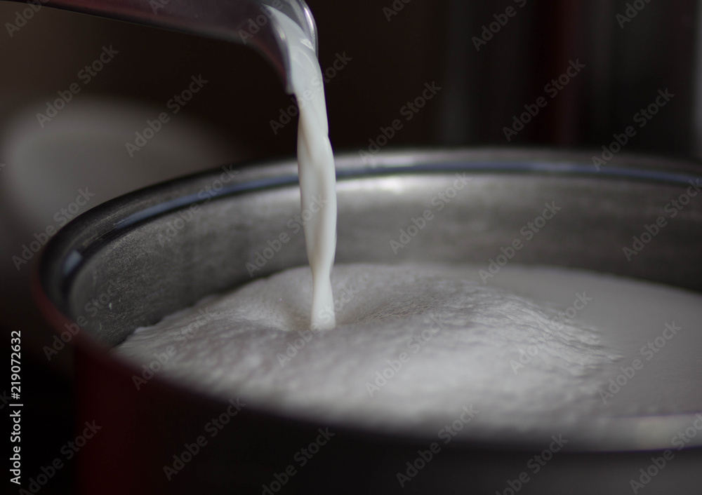 Clarification, skimming, milk separation from fat Stock Photo | Adobe Stock