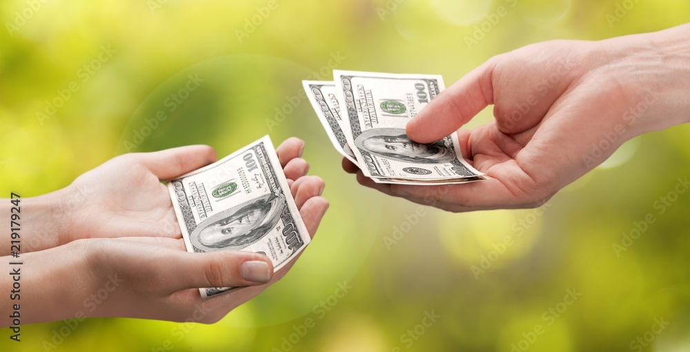 Two hands holding dollars banknote over background Stock Photo | Adobe ...