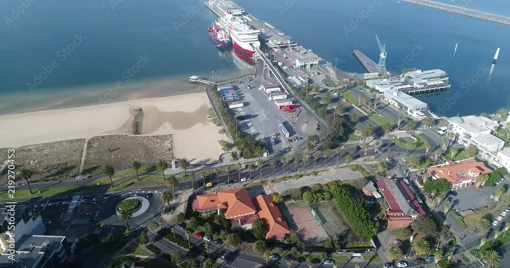 Ferry terminal, wharf and trans tasman ferry under cargo load in Port ...