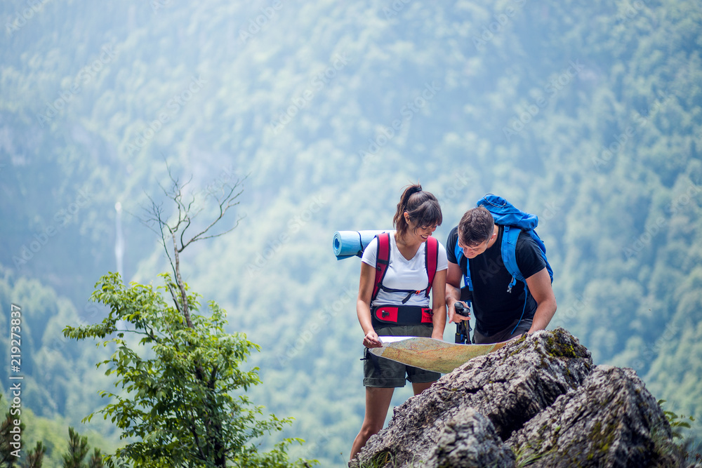 Hikers using map to navigate outdoor Stock Photo | Adobe Stock