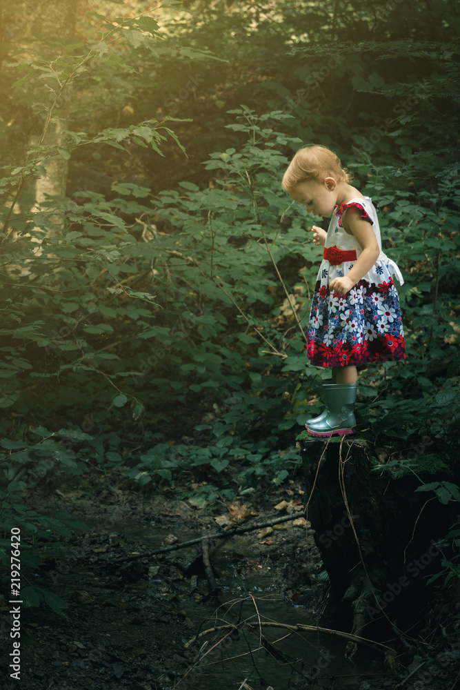 Little Girl Playing In The Woods