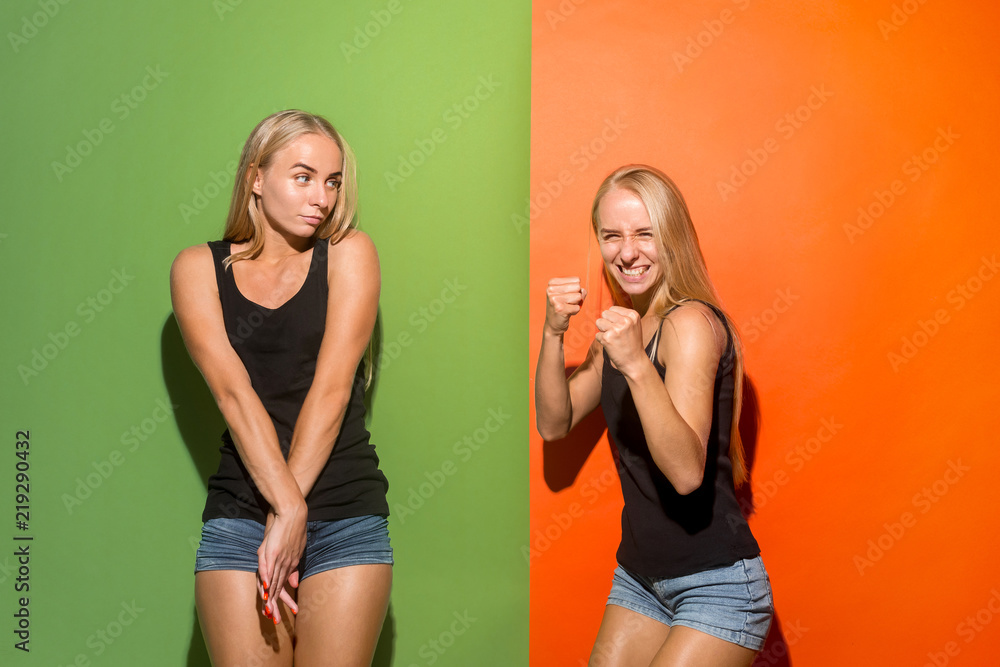 Angry woman. Aggressive woman standing isolated on trendy studio ...