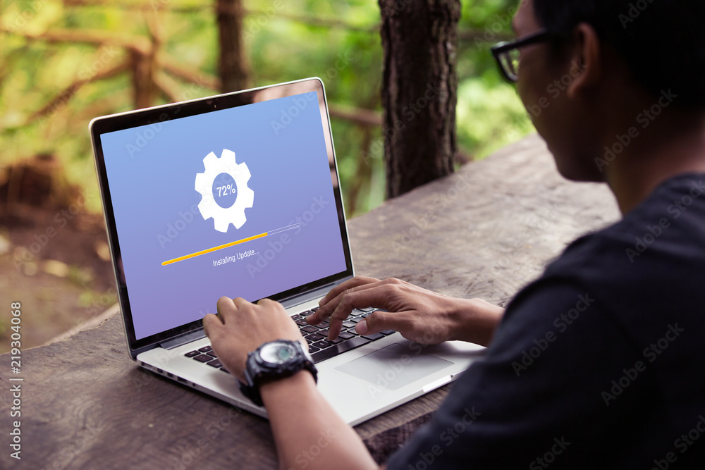Man working and Installing update process with gearbox percentage ... Man working and Installing update process with gearbox percentage ...
