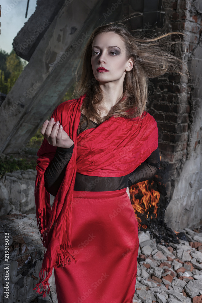 Beautiful Fashion Model Girl Wearing A Red Long Skirt And A Red Shawl