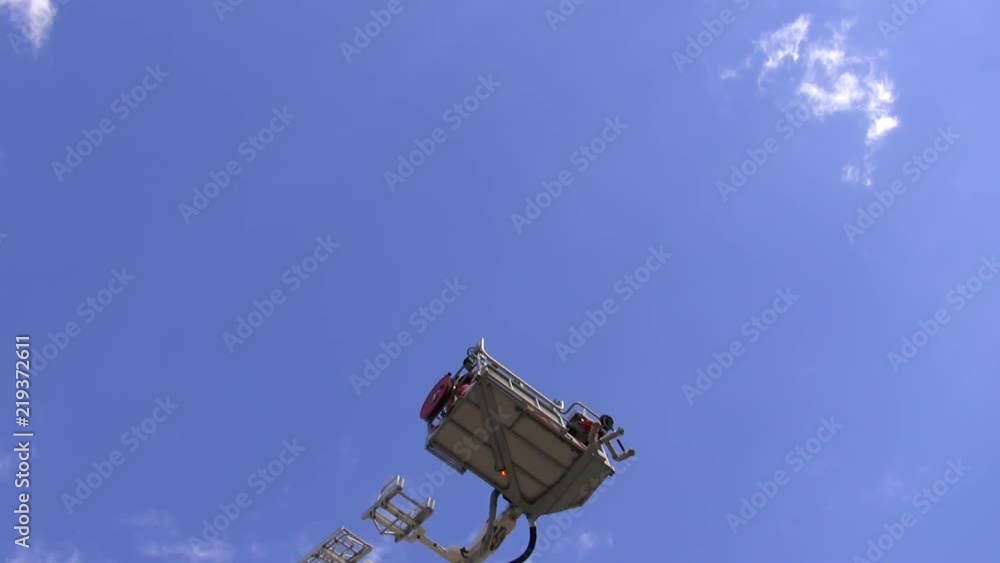 Telescopic firefighters aerial ladder platform is raising with people ...