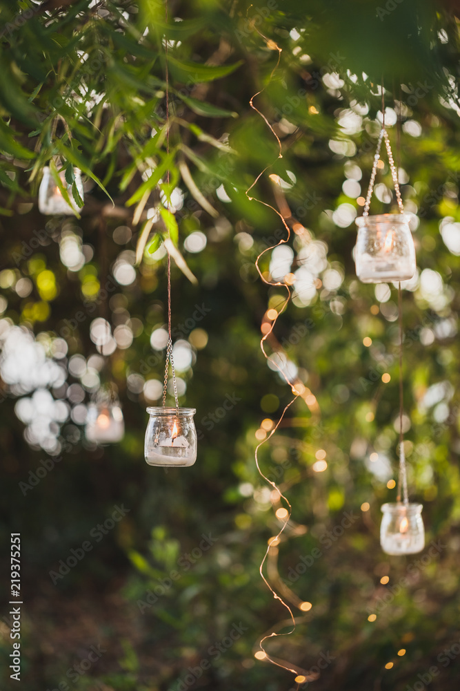 Candles Hanging From Trees