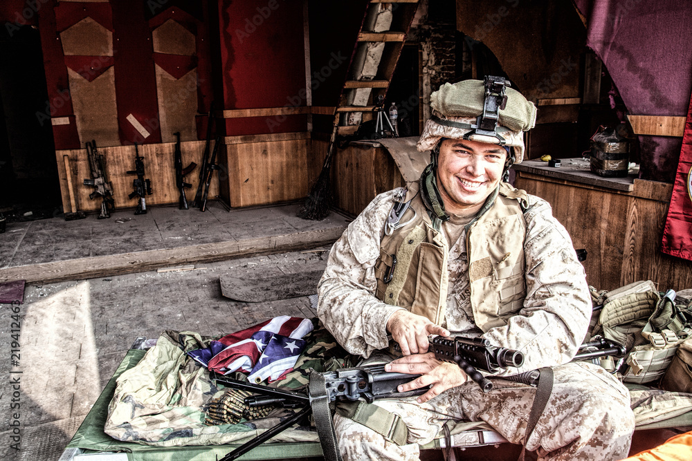 Marine Corps machine gunner smiling, disassembling, making maintenance ...