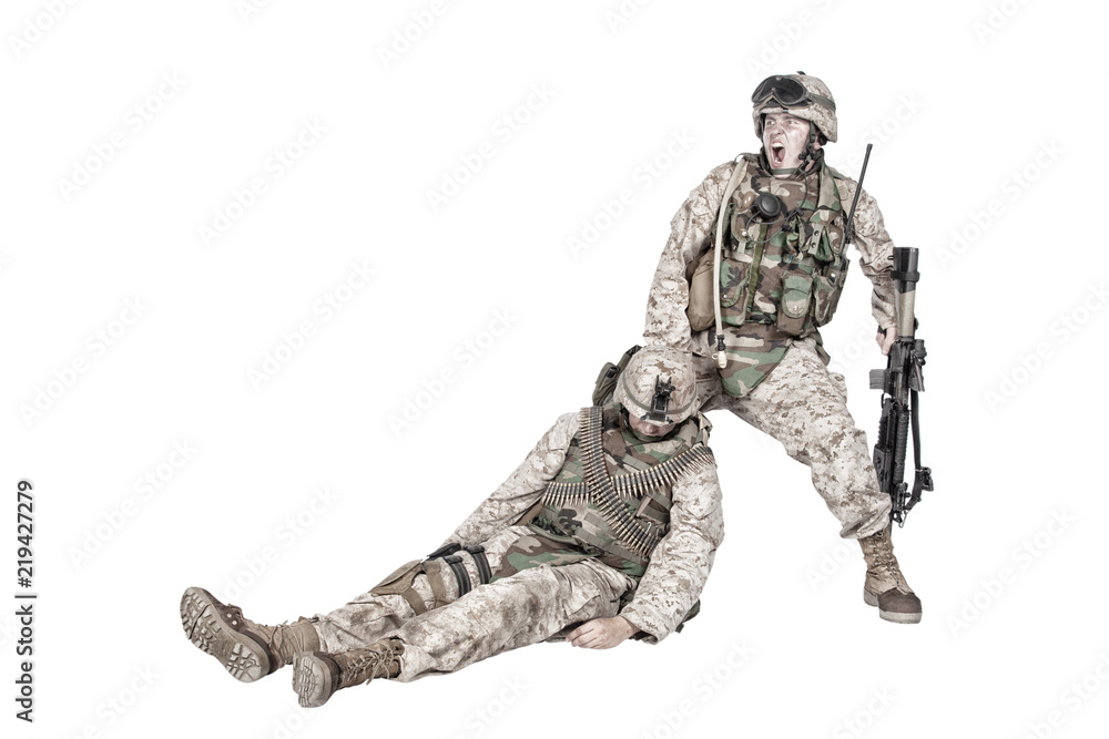 Commando soldier screaming and dragging backwards for plate carrier ...