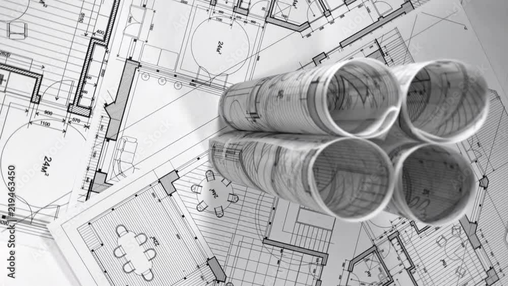 Blueprints - rolls of architectural drawings smoothly rotate on the ...