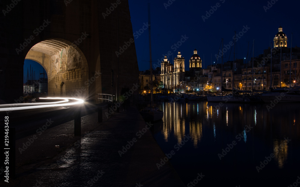 A city at night. A night view in Birgu, Malta - waterfront with a ...