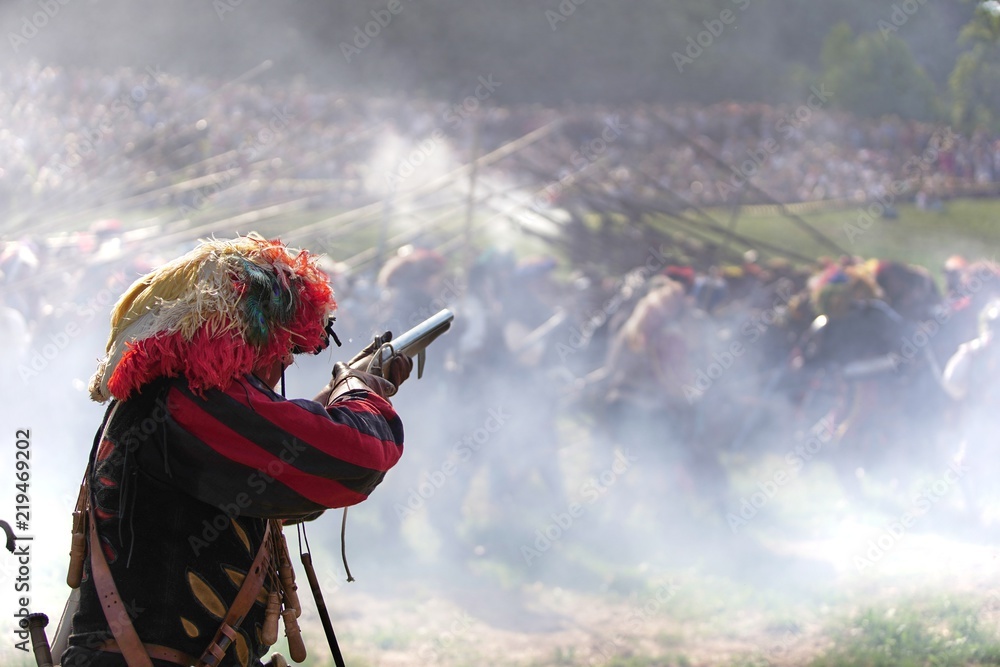 Lansquenet mercenary soldier aiming a flintlock gun Stock Photo | Adobe ...