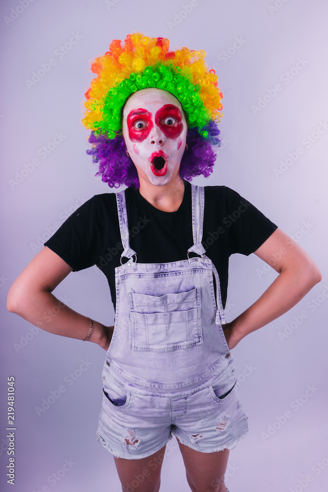 girl in a bright image of a clown. emotional portrait of a student ...