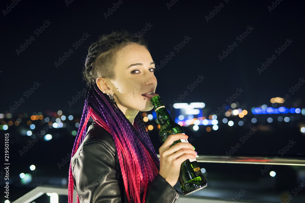 Female tongue in a bottle. Closeup view of female facial body part of ...