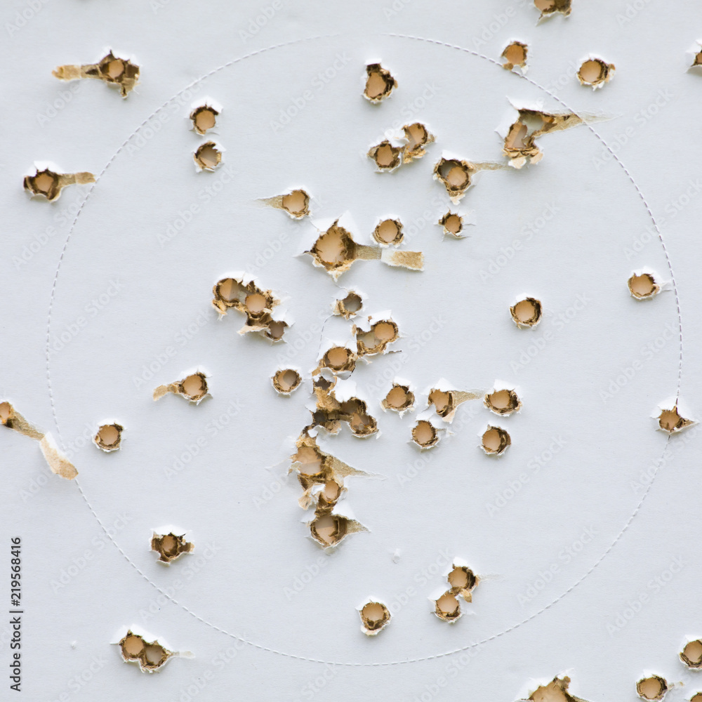 Paper shooting target with bullet holes Stock Photo | Adobe Stock