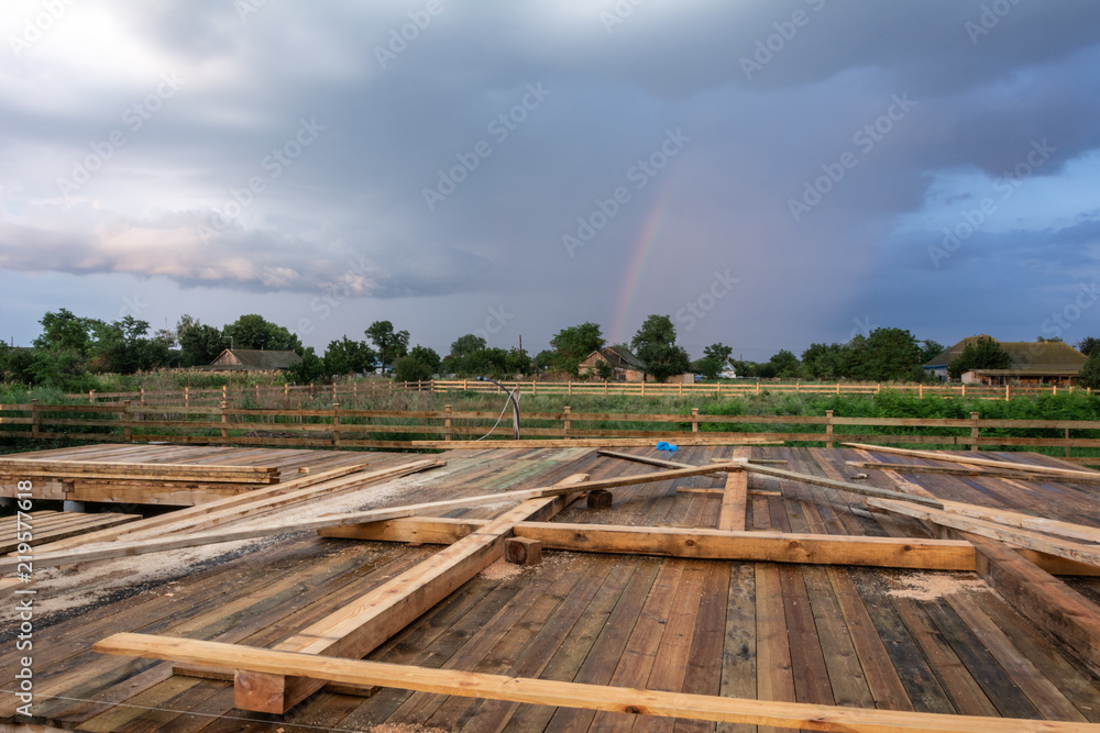 Stages of construction of a timber frame house with a triangular type A ...