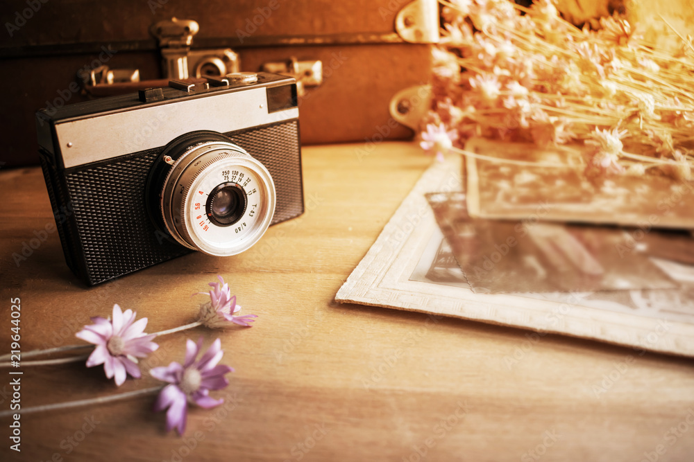 Close up of old camera lens over blurredbackground of old leather ...