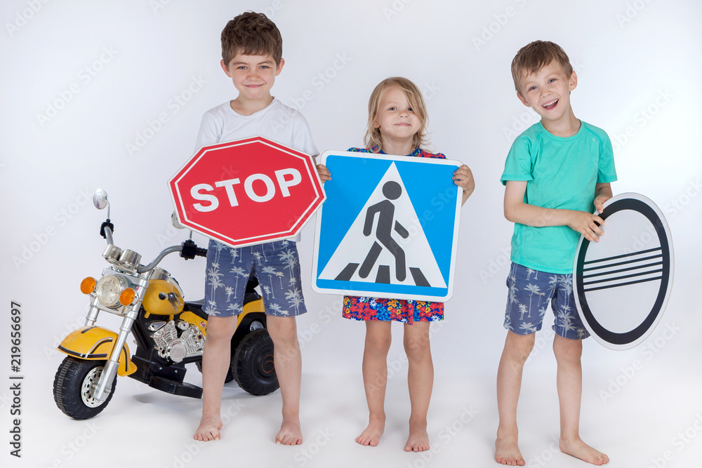 The children show the road signs. Children and a motorcycle. Chopper ...